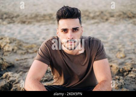 Handsome hispanic man looking at travel map at the park Stock Photo - Alamy