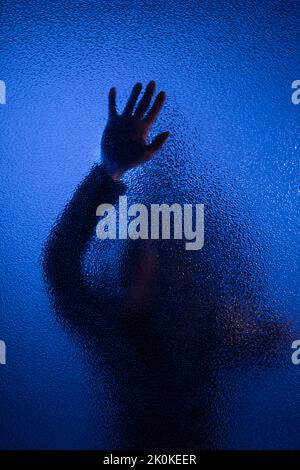 Shadow of woman screaming behind the glass, domestic violence concept ...