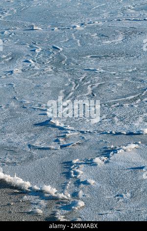 Ice piles up on the shores of lakes and takes many varied shapes ...