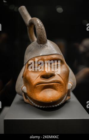 Vessel in the form of a priest or lord. Moche culture. 200-700. Painted ...