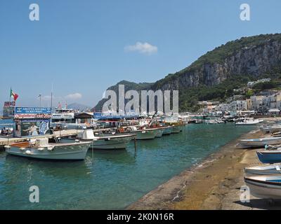 Port of Capri with many tourist boats that are used to visit the grotto ...