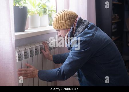 Man wearing warm clothing feeling cold . Energy crisis in Europe Stock ...
