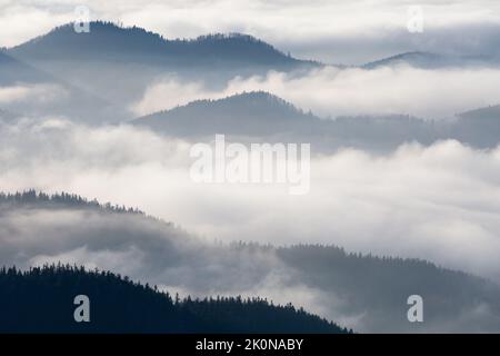 Mala Fatra mountain range shrouded in low clouds, Slovakia Stock Photo ...
