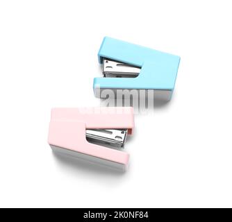 Two colorful staplers isolated on white background Stock Photo - Alamy