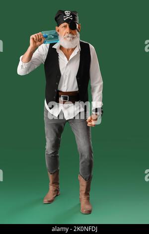 Old pirate with bottle of rum on dark background Stock Photo - Alamy
