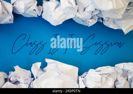 Class Is In Session text with Torn, Crumpled White Paper on colored ...