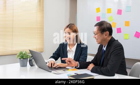 Business partnership concept, Businesswoman is typing on laptop during ...