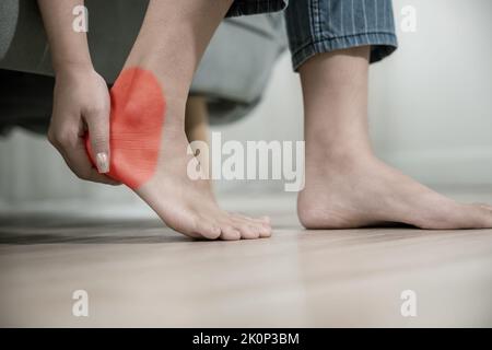 Asian beautiful female problems with foot at home, painful ankle injury ...