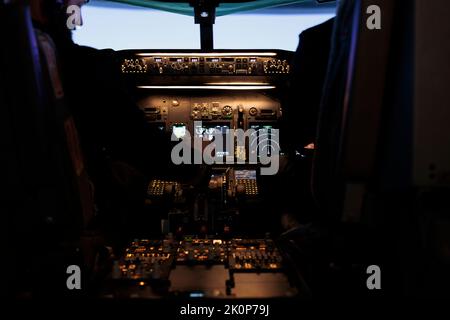 Airline pilot using control panel in aircraft cockpit Stock Photo - Alamy