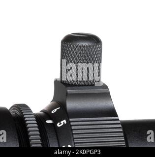 Magnification dial on a rifle scope and speed bump isolated on white ...