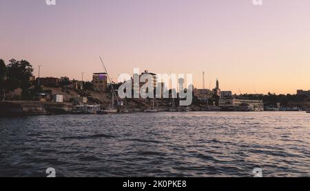 Sunset View to the Panoramic Aswan cityscape with the Palm Trees, Egypt ...