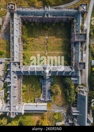 Aerial birds eye view of abandoned mansion house and boarding school. A ...