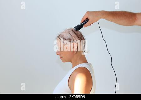 consequences of chemotherapy. Shaving off the last hair on the head ...