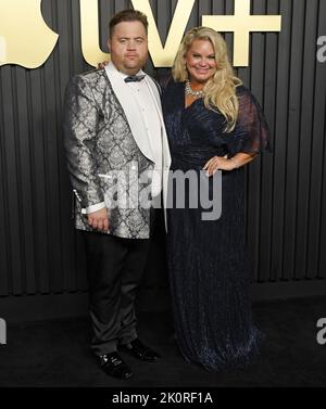 Paul Walter Hauser and his wife Amy pose together at the premiere of ...