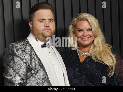 Paul Walter Hauser and his wife Amy pose together at the premiere of ...