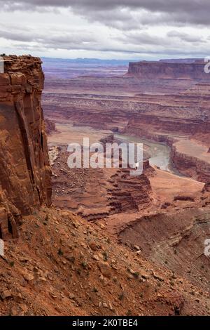 The massive wingate sandstone cliffs along the Murphy Trail lit up with ...