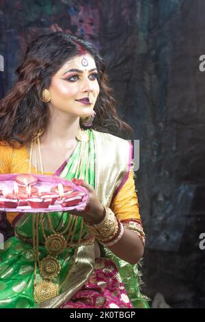 Agomoni concept photo shoot, A poses for the camera with an unfinished ...