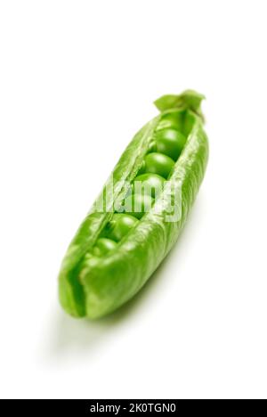 Single pea pod opened on white background cut out Stock Photo - Alamy