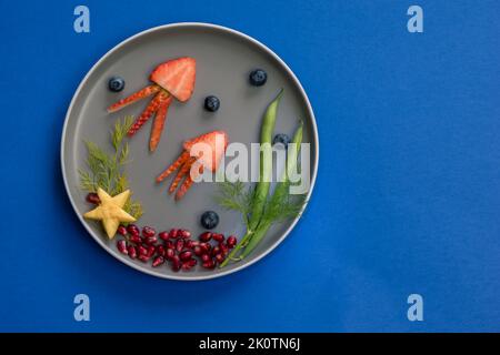 jellyfish, green plants and starfish in sea world from strawberries ...