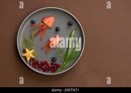 jellyfish, green plants and starfish in sea world from strawberries ...