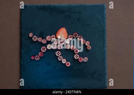 octopus made from red fruits with sea world from cauliflower, broccoli ...