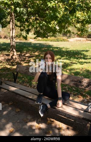 smartphone phone with green screen on wooden table Stock Photo - Alamy