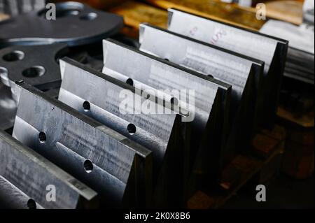 Processed metal plates with ground edges in warehouse Stock Photo - Alamy