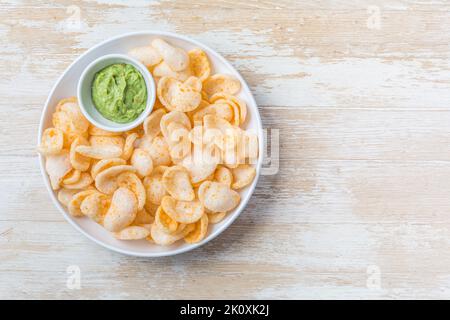 Fried shrimp cracker in thai style. Shrimp cracker with avocado dip ...