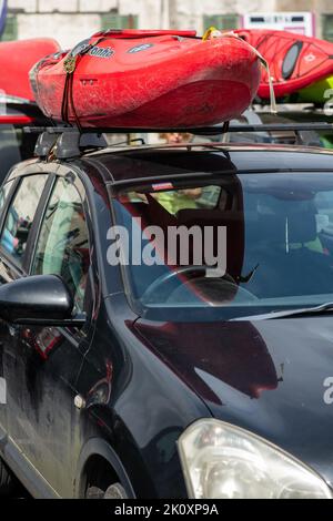 Kayaks, colorful kayaks on display for sale at small trade fair ...