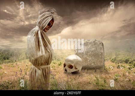 Pocong is covered with a white linen shroud standing with full moon ...