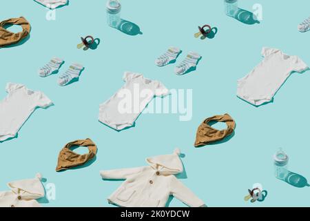 Baby clothes with accessories on blue background. Different color ...