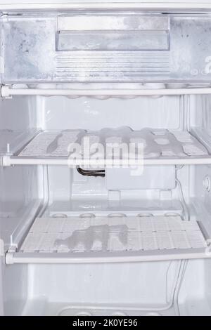 defrost refrigerator. melting ice in fridge Stock Photo - Alamy