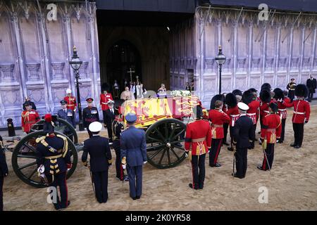 The Bearer Party carry the coffin in to the funeral for Captain ...