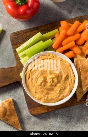 Homemade Red Pepper Hummus Dip with PIta and Veggies Stock Photo - Alamy