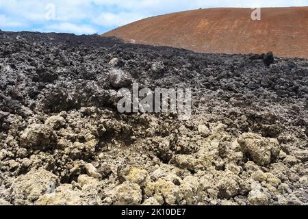 Volcanoes, black lava and islets of Lanzarote seen from Caldera Blanca ...