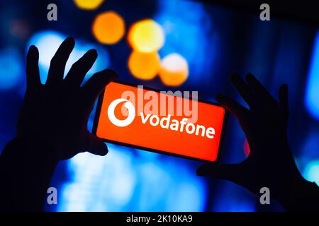 In this photo illustration, the Vodafone logo seen displayed on a ...