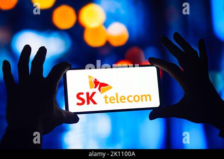 In this photo illustration, the SK Telecom logo is seen displayed on a ...