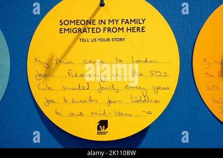 individual immigration story written on a paper discs at migration ...