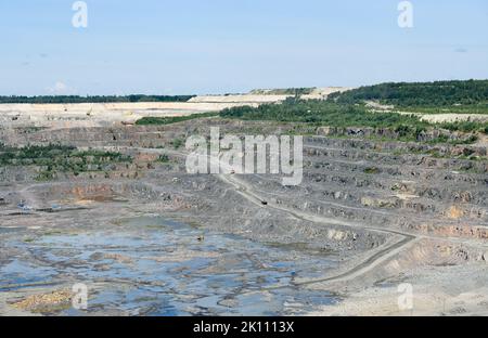 Technique works in a large mining quarry Stock Photo - Alamy