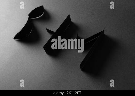 Paper alphabet letters BHM with shadow on black background. Black ...