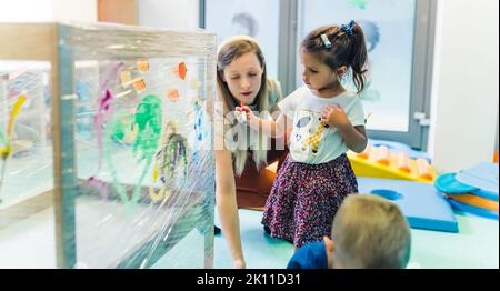 Cling film painting for improving kids imagination. Toddlers painting ...