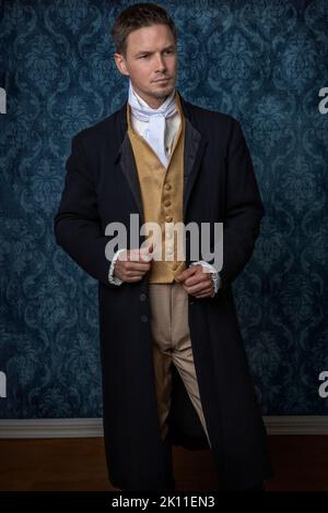 A Regency gentleman wearing a gold waistcoat and breeches Stock Photo ...
