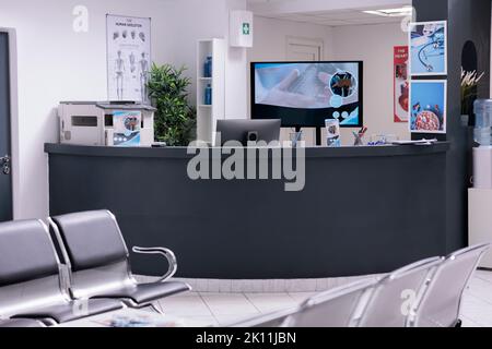 Facility registration counter in waiting area lobby, computer to make ...