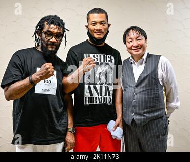 Andy Hiraoka (R) of Japan and his his trainer and father Justice Codjoe ...