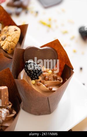 sweet dessert black waffles with creamy filling inside, laid out on a ...