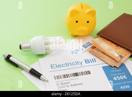 Electricity and gas bills, euro banknotes, light bulb and piggy bank ...