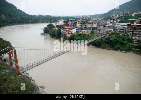 Ancient Hindu temple and the old suspension bridge Victoria in Northern ...