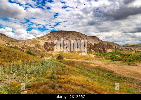 buildings carved into the rock in yaprakhisar in turkey Stock Photo - Alamy