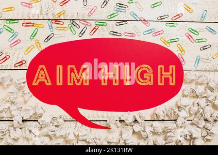 Hand writing sign Aim High. Conceptual photo go for best job school or ...