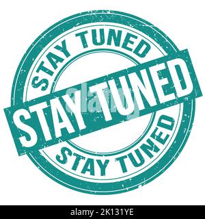 STAY TUNED, text on blue rectangle stamp sign Stock Photo - Alamy